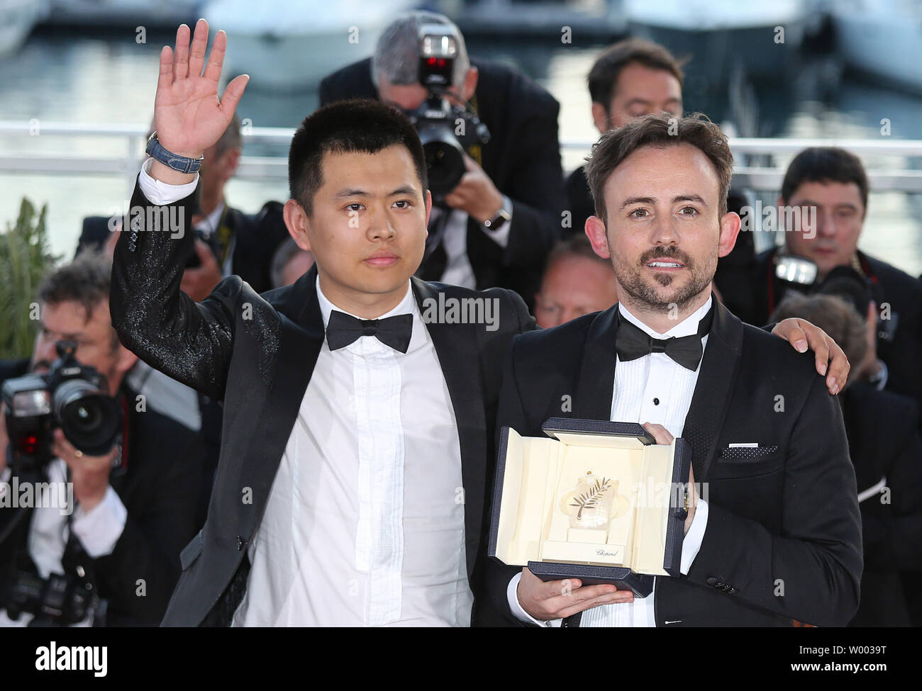 Wei Shujun (L), winner of the special mention award for his film ...