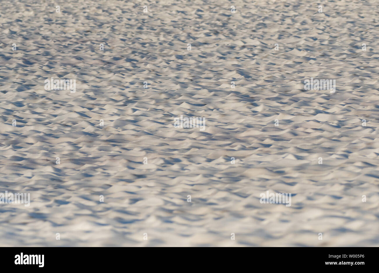 Low Angle Texture of Snow Field as it melts in summer Stock Photo - Alamy