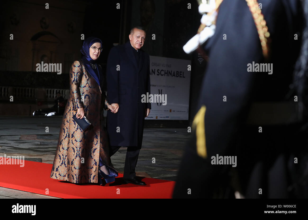Turkish President Recep Tayyip Erdogan and his wife, Emine, walk the ...
