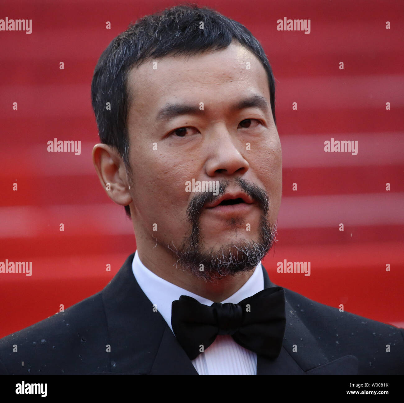 Liao Fan arrives on the red carpet after the screening of the film "The ...