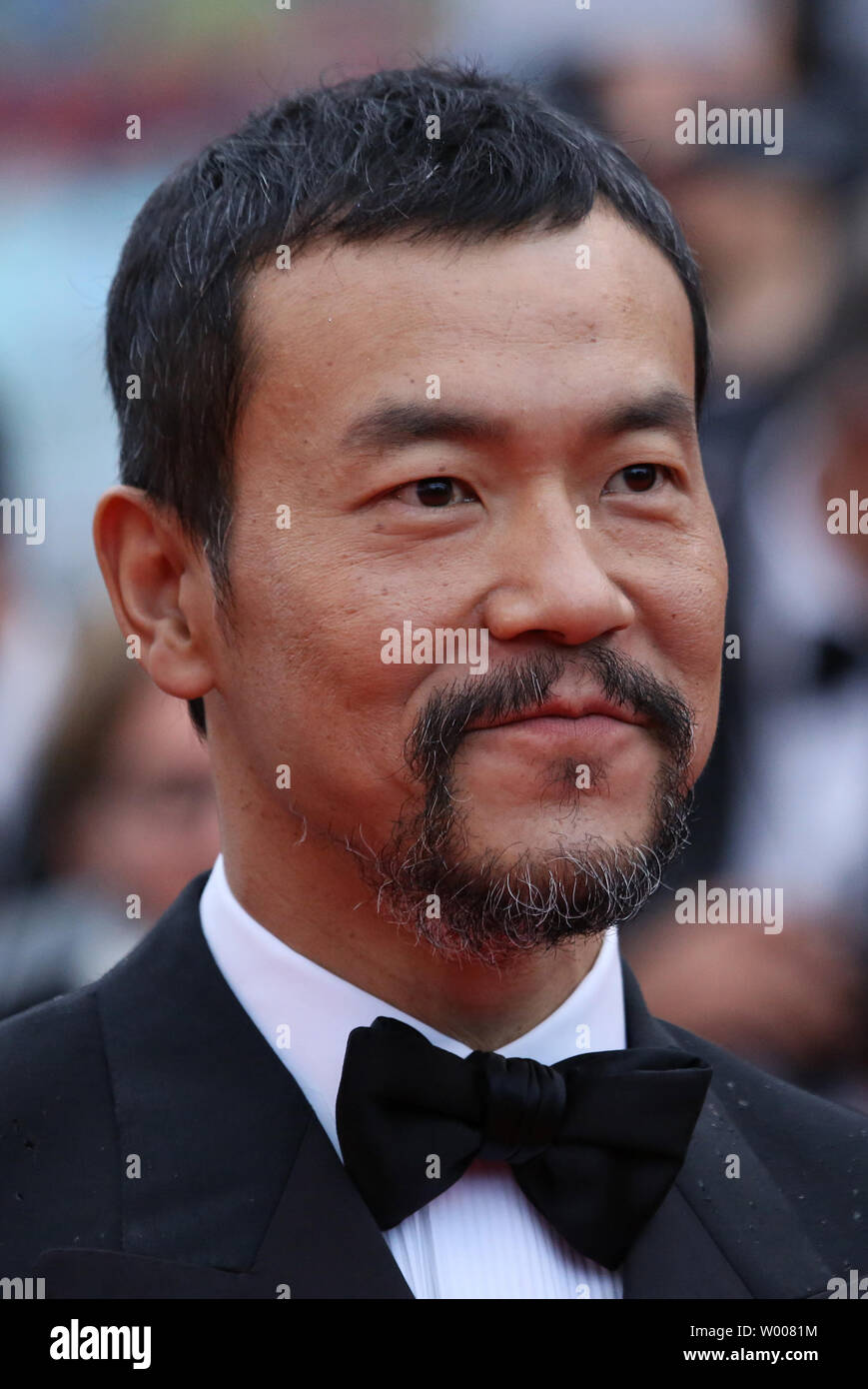 Liao Fan arrives on the red carpet after the screening of the film "The ...