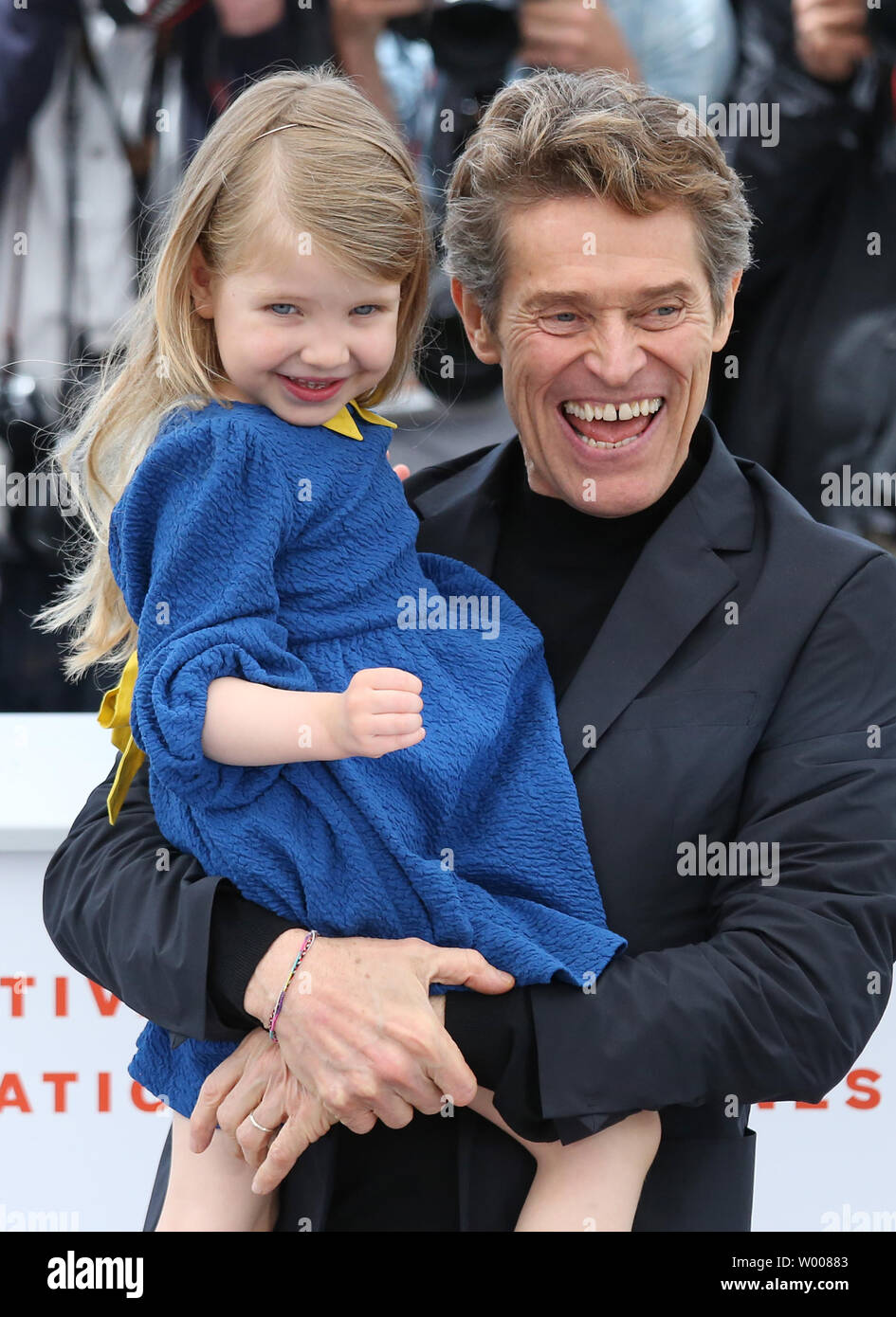 Anna Ferrara (L) and Willem Dafoe arrive at a photocall for the film ...