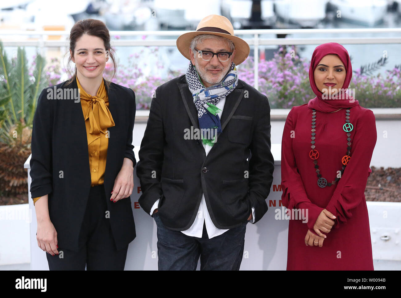 Hanaa Issa (L), Elia Suleiman (C) and Fatma Hassan Al Remaihi arrive at ...