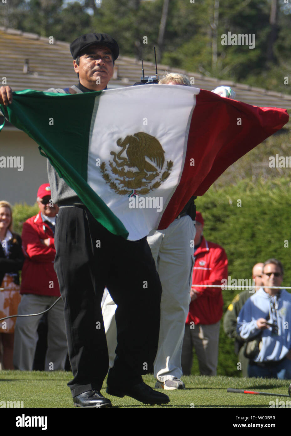 Comedian George Lopez waves the Mexican flag on the first tee of the 3M ...