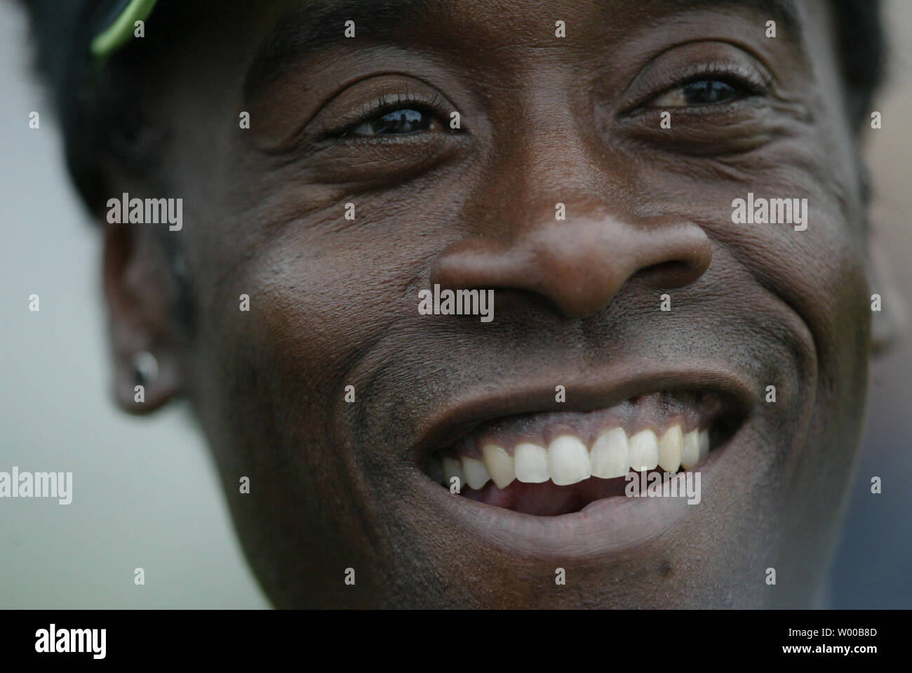 Don Cheadle smiles with friends on the practice green before the AT&T ...