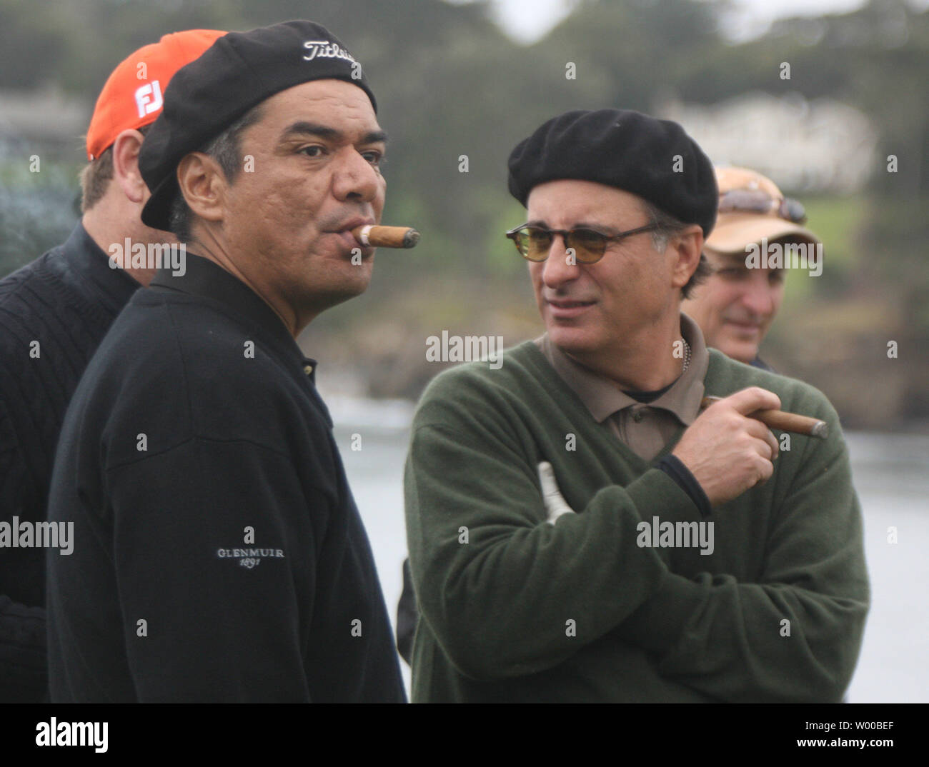 Actors George Lopez and Andy Garcia smoke cigars during the 3M ...
