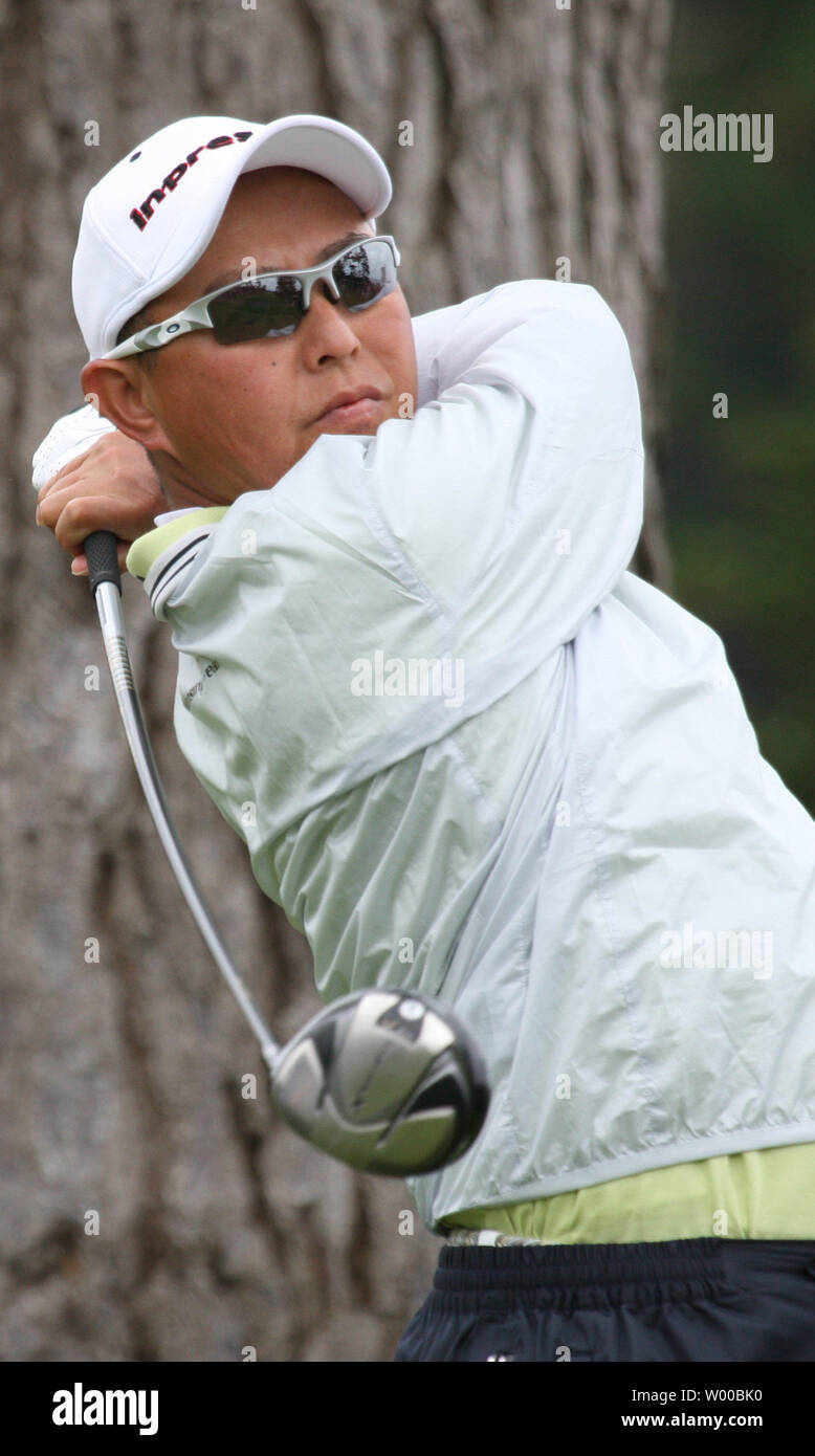 Toru Taniguchi of Japan tees off on the 13th hole in the second round ...