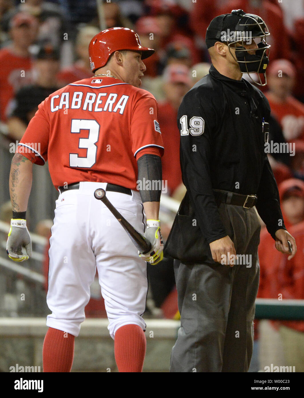 Washington Nationals Asdrubal Cabrera (L) yells at home plate umpire ...