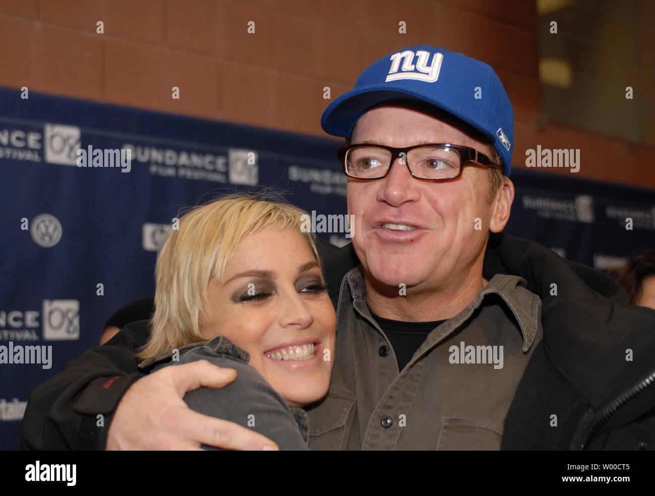 Actress Sharon Stone (L) and actor Tom Arnold attend the premiere of ...