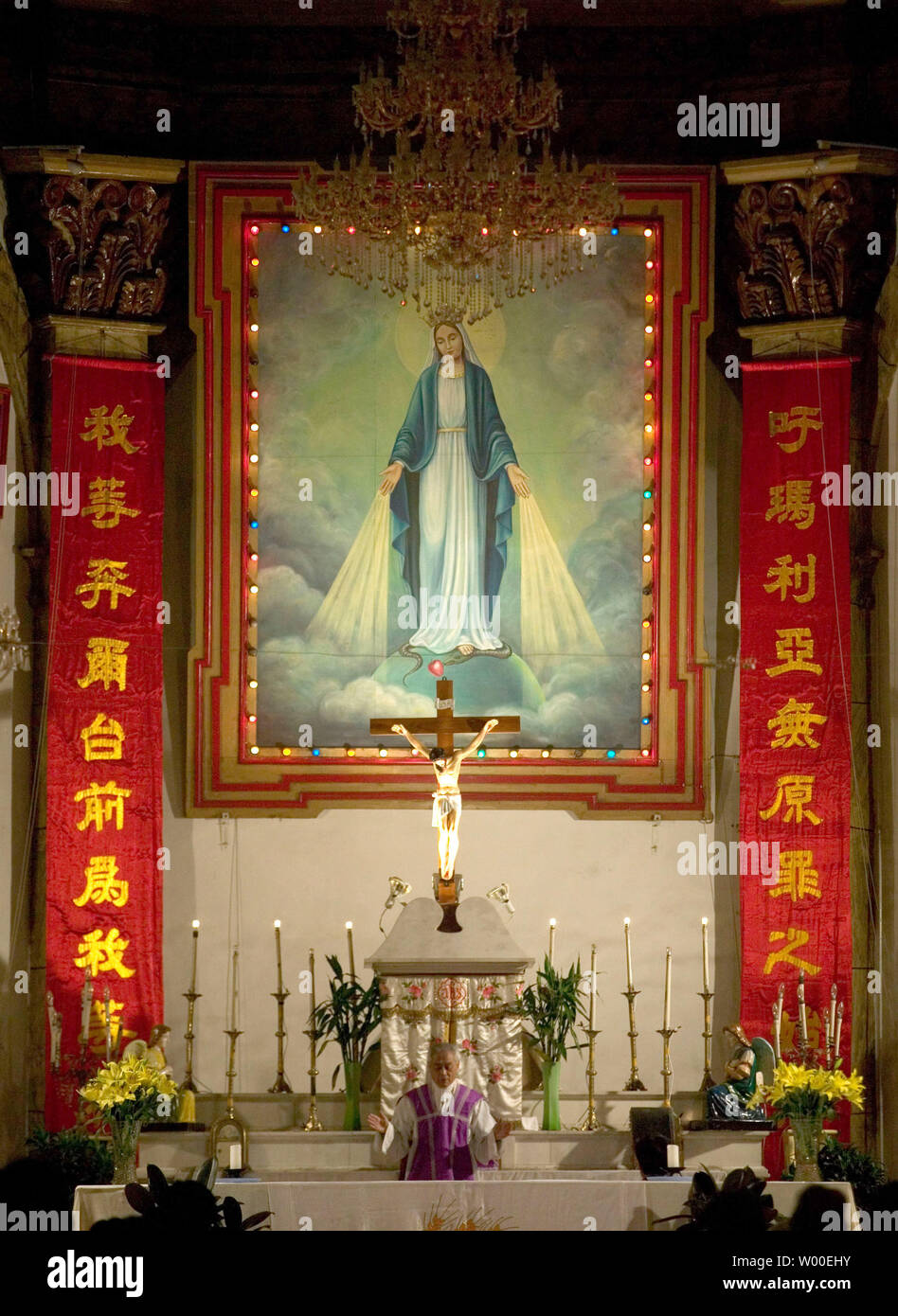 Chinese Catholic priests hold an early morning mass at the government ...