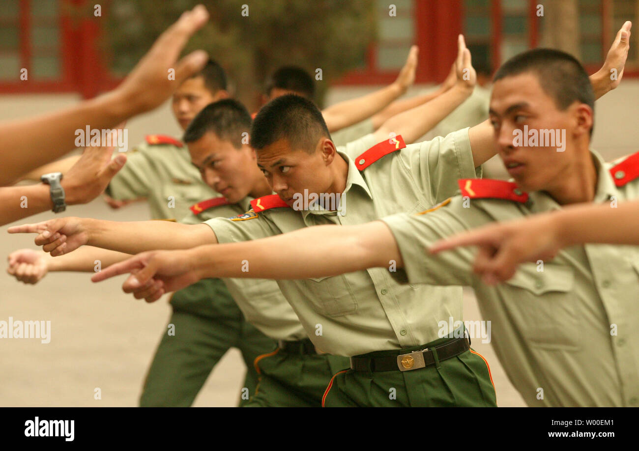 A Chinese paramilitary police do martial arts exercises in their ...