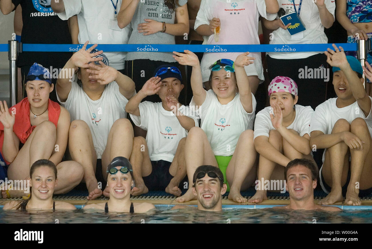 U.S. Olympic swimmers (in pool) Megan Jendrick (L), Katie Hoff (2nd L ...