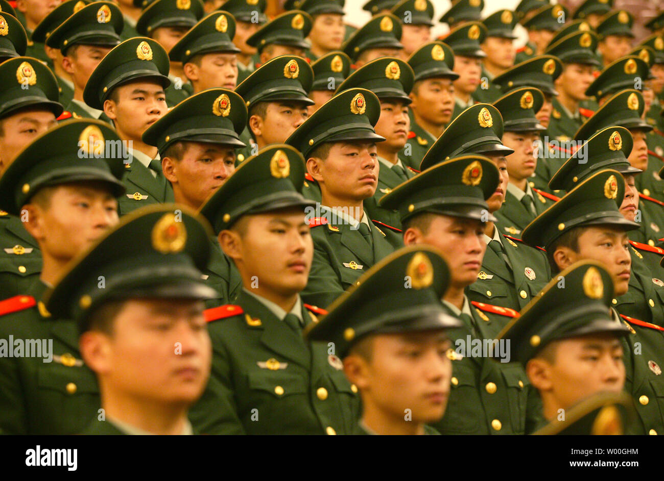People's Liberation Army (PLA) soldiers attend a grand rally to ...