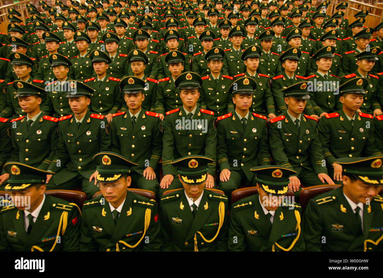 People's Liberation Army (PLA) soldiers attend a grand rally to ...