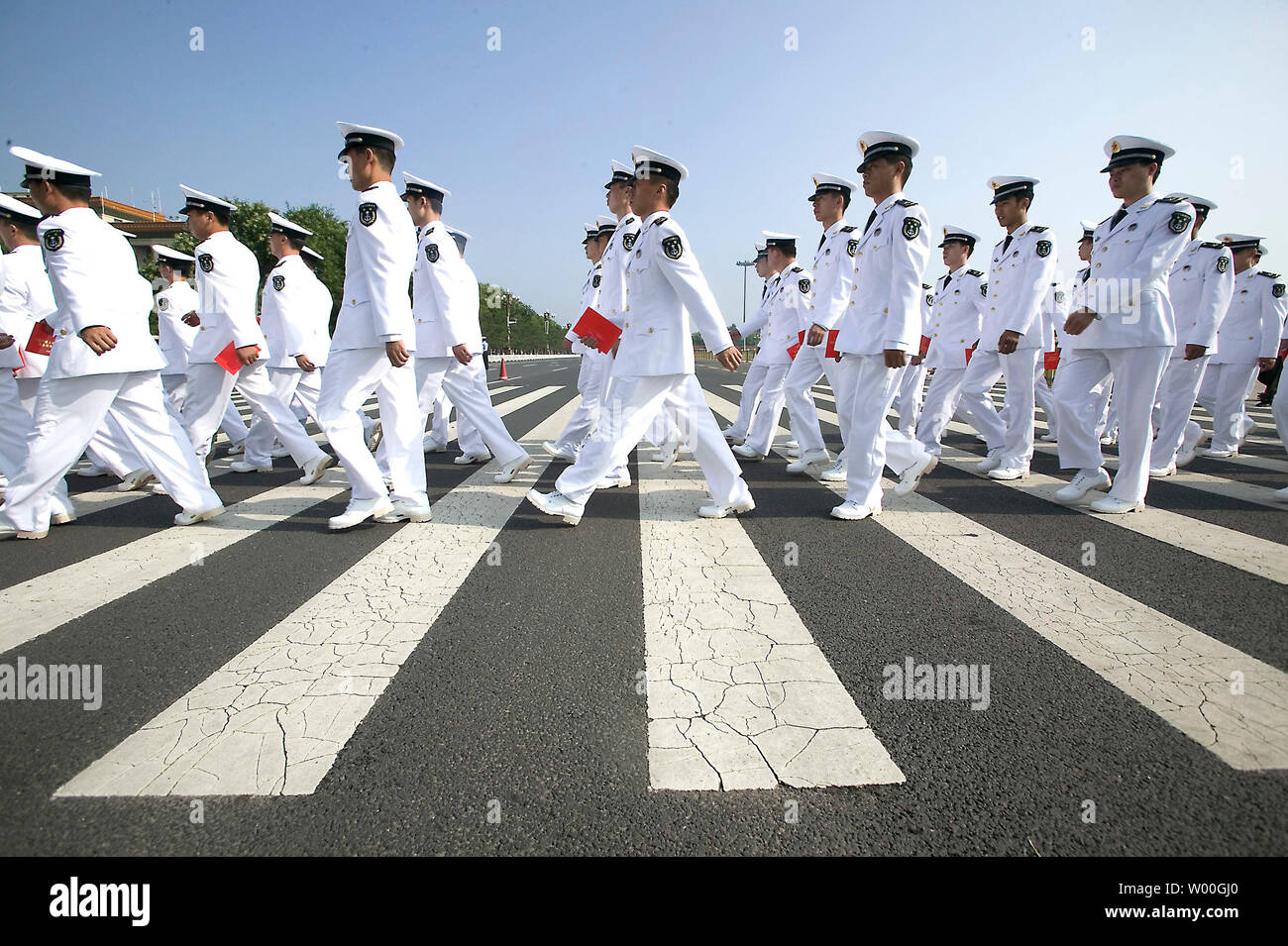 People's Liberation Army (PLA) soldiers arrive for a grand rally to ...