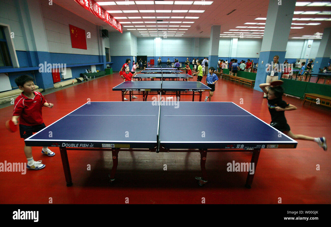 Young Chinese athletes practice table tennis at the Shishahai Sport ...