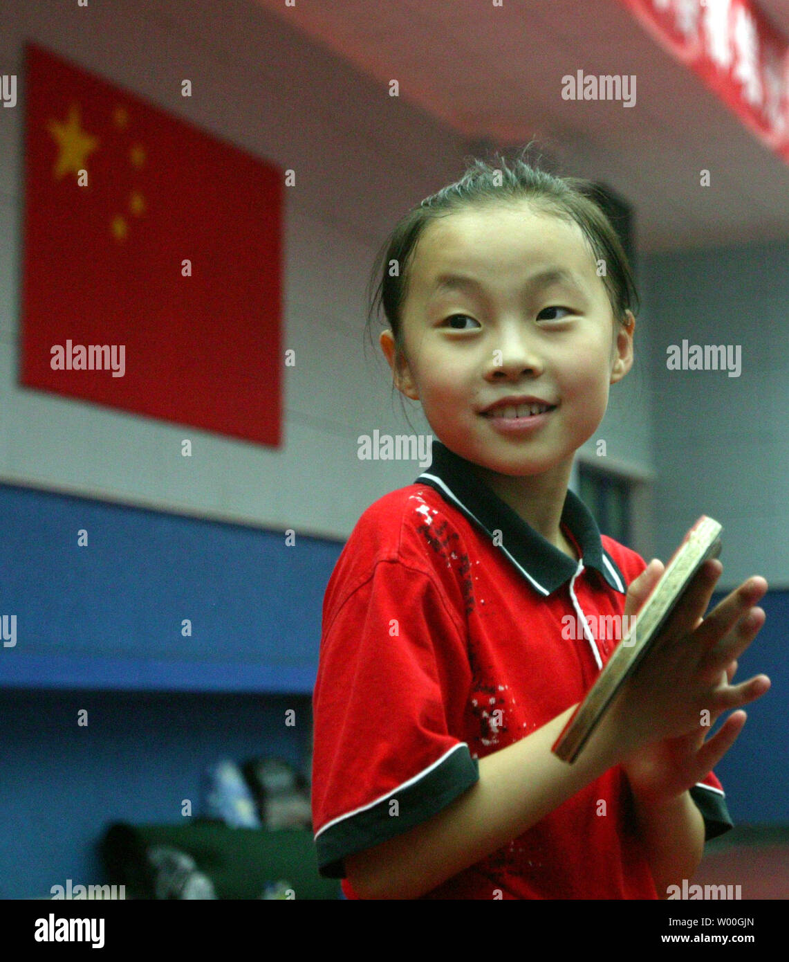 Young Chinese athletes practice table tennis at the Shishahai Sport ...