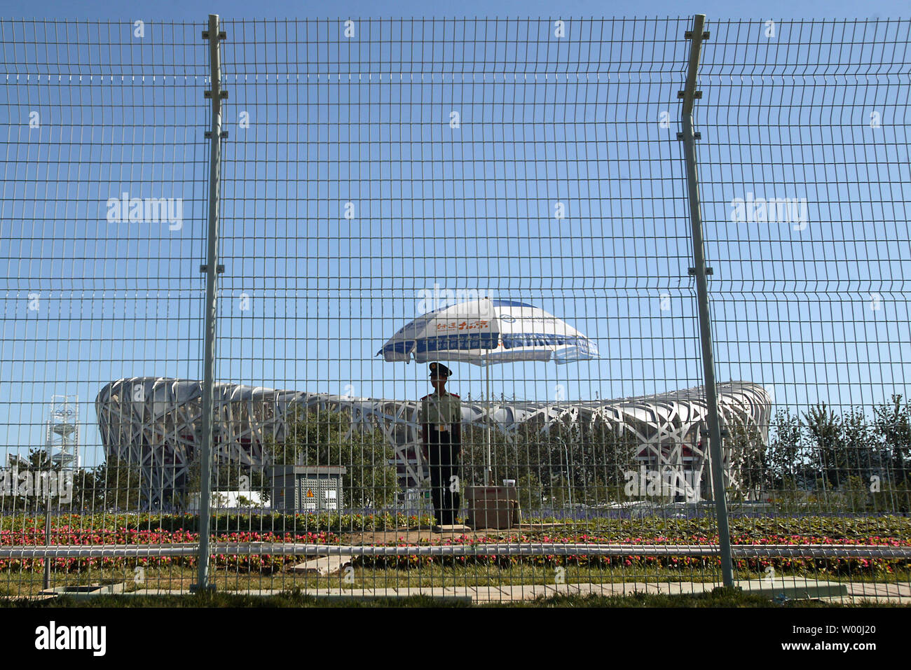 Chinese paramilitary police guard the National Stadium, also known as ...