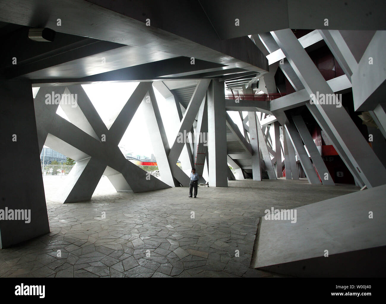 A security guard patrols the inside the National Stadium, also known as ...