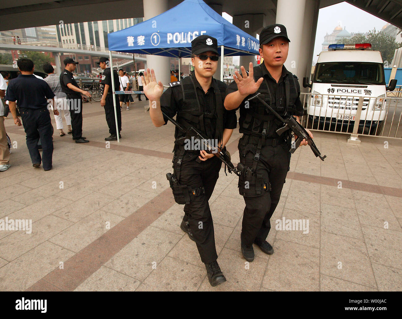 Officers of Beijing SWAT unit patrol the grounds of A Beijing train ...