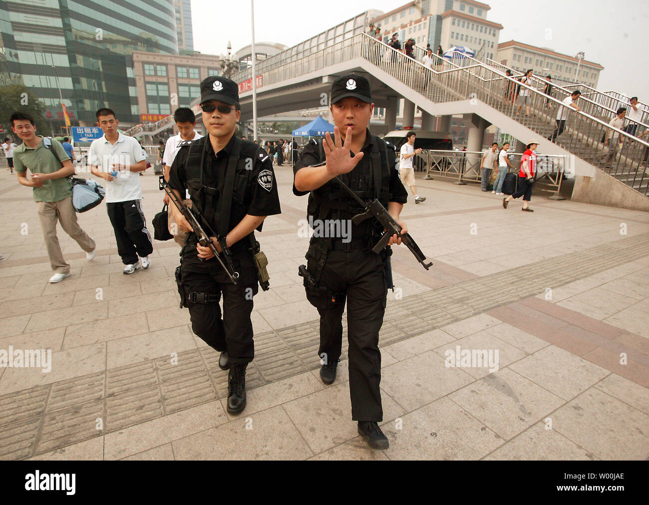 Officers of Beijing SWAT unit patrol the grounds of A Beijing train ...