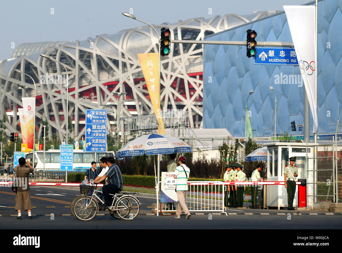 Soldiers guard a security checkpoint and entrance to the Olympic Green ...