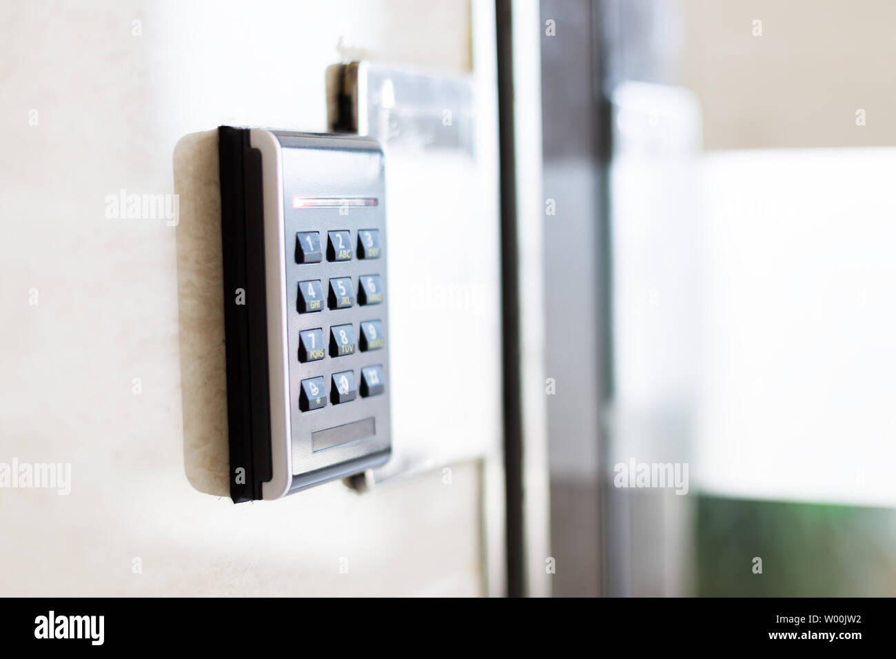 Fingerprint scanner on wall Stock Photo - Alamy