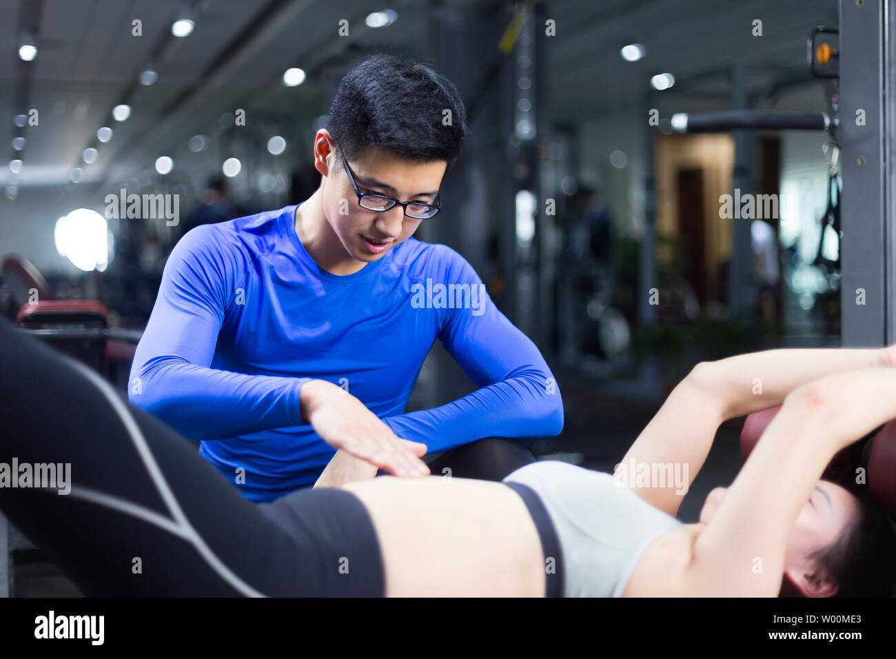 young asian people working out in modern gym Stock Photo - Alamy
