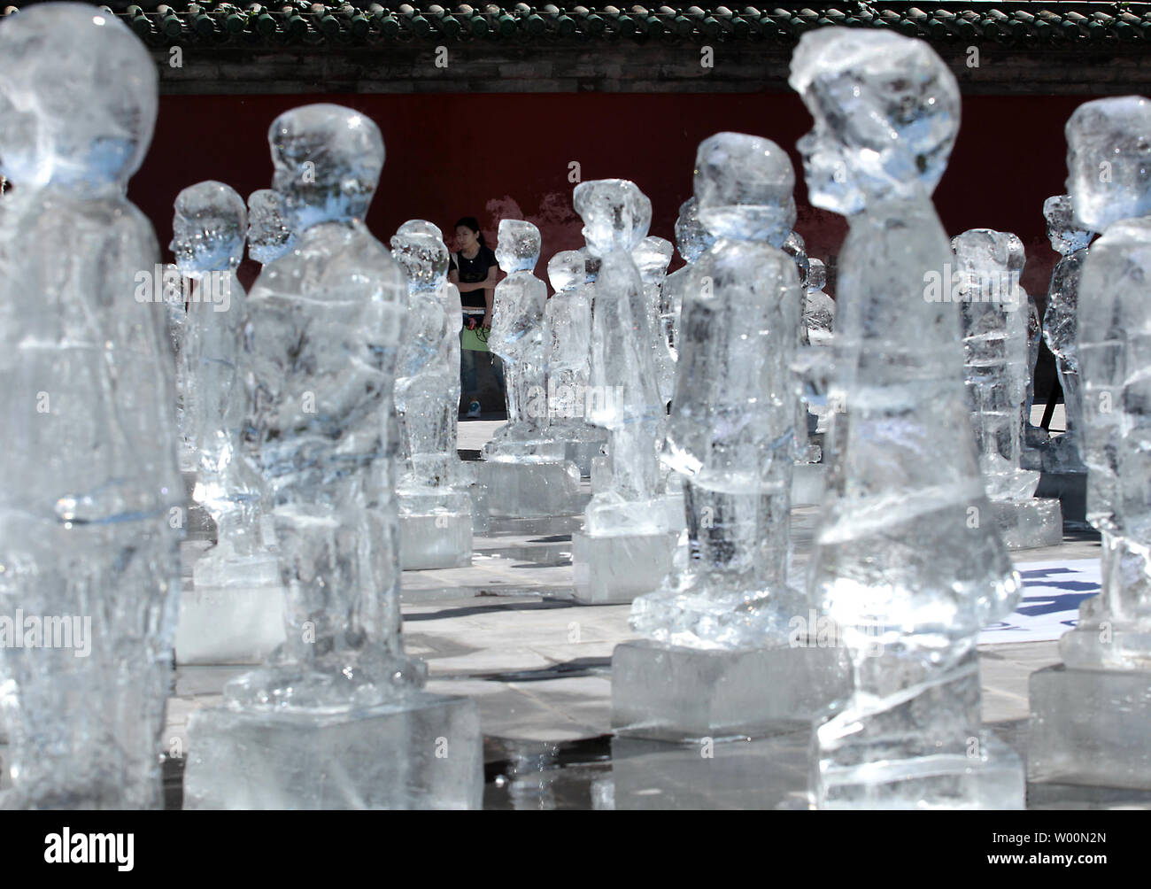 Ice sculptures of 100 children melt in the sun at Beijing's Temple of ...