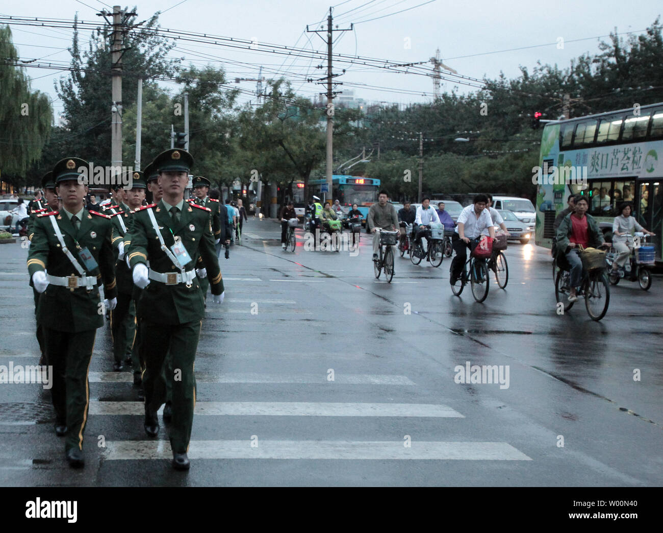 Chinese soldiers patrol the streets around a sealed off float-staging ...