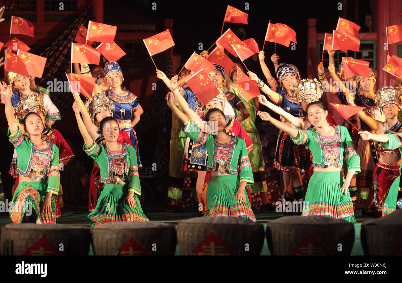 Dong ethnic minorities wear traditional garb during a cultural ...