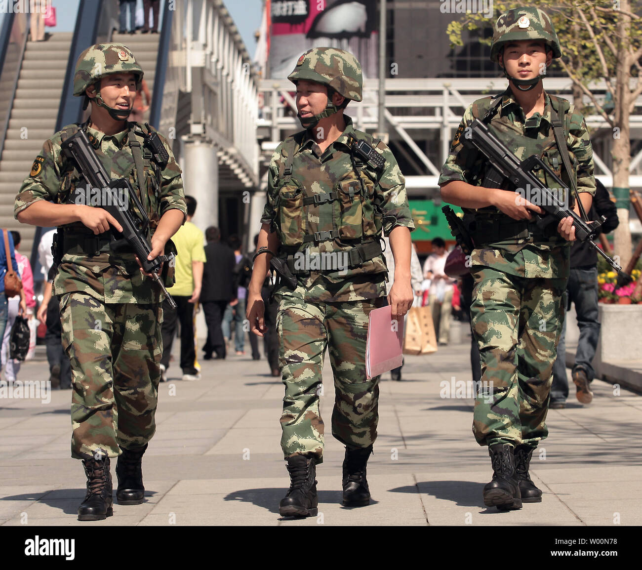 Chinese soldiers patrol the streets of downtown Beijing on September 23 ...