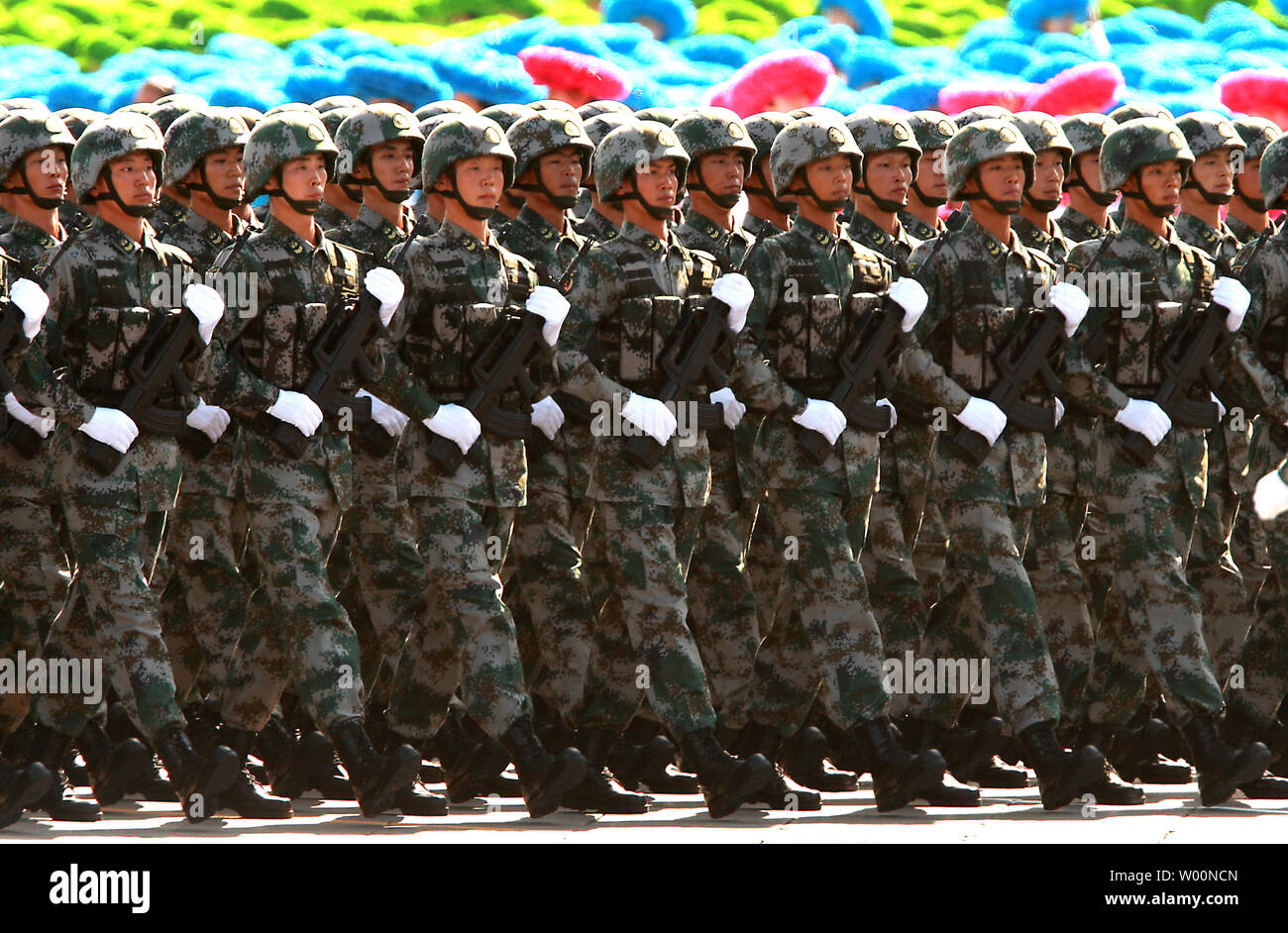 Chinese soldiers participate in a massive military parade celebrating ...