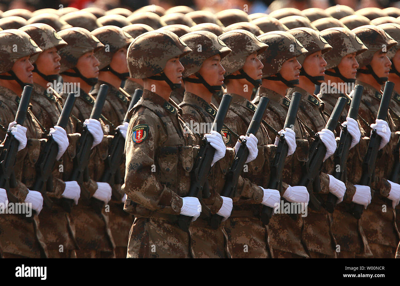 Chinese soldiers participate in a massive military parade celebrating ...