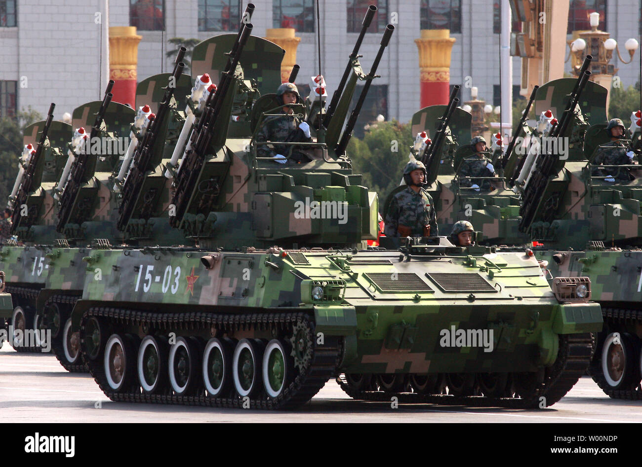 Chinese soldiers participate in a massive military parade celebrating ...