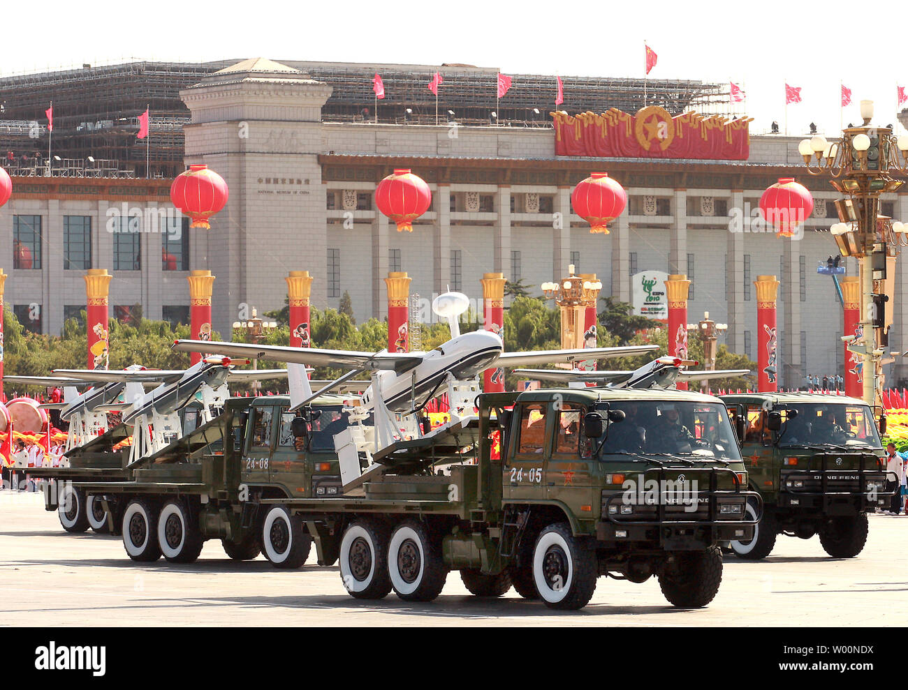 Chinese soldiers participate in a massive military parade celebrating ...