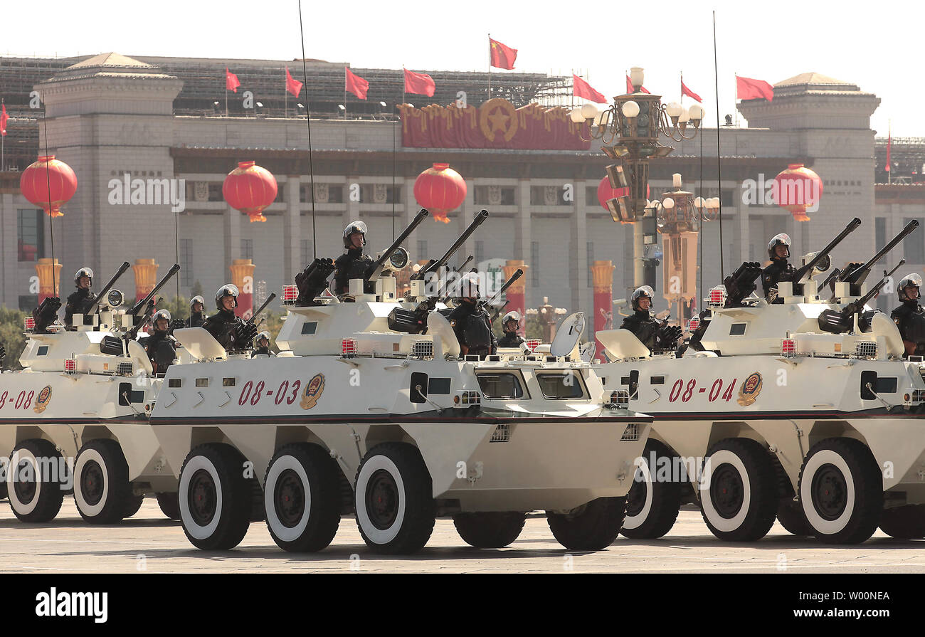 Chinese soldiers participate in a massive military parade celebrating ...