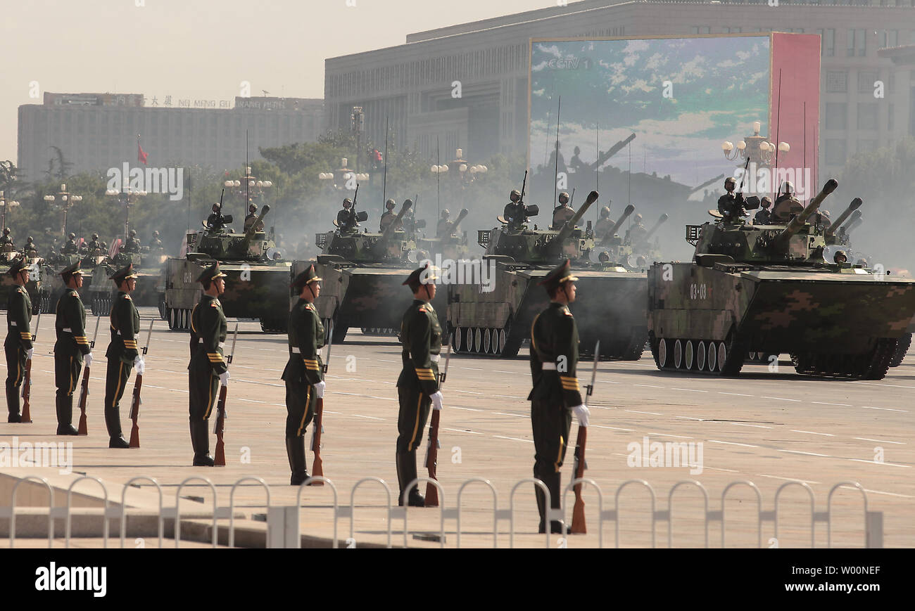 Chinese soldiers participate in a massive military parade celebrating ...