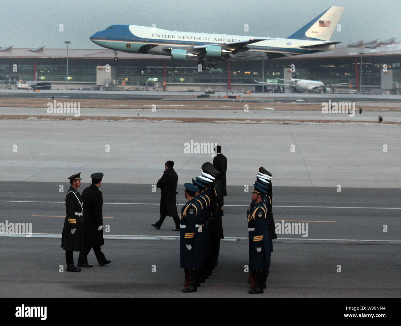 Chinese soldiers stand at attention as Air Force One and President ...