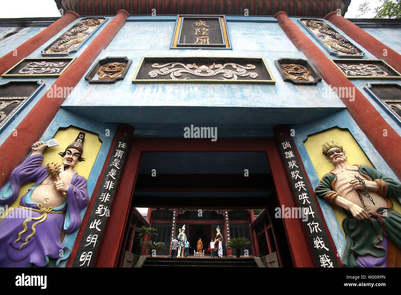 Guarded by demons, tourists visit the Ghost Temple in the city of ...
