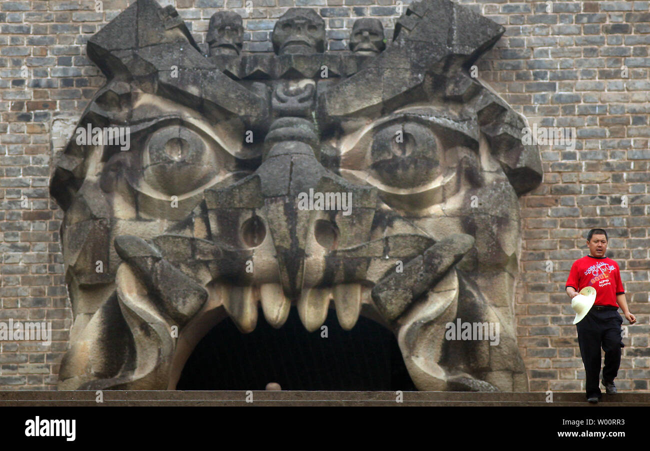 Guarded by demons, tourists visit the Ghost Temple in the city of ...
