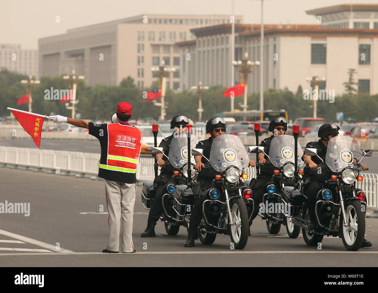 A Chinese SWAT team rides past Tiananmen Square in Beijing, September ...