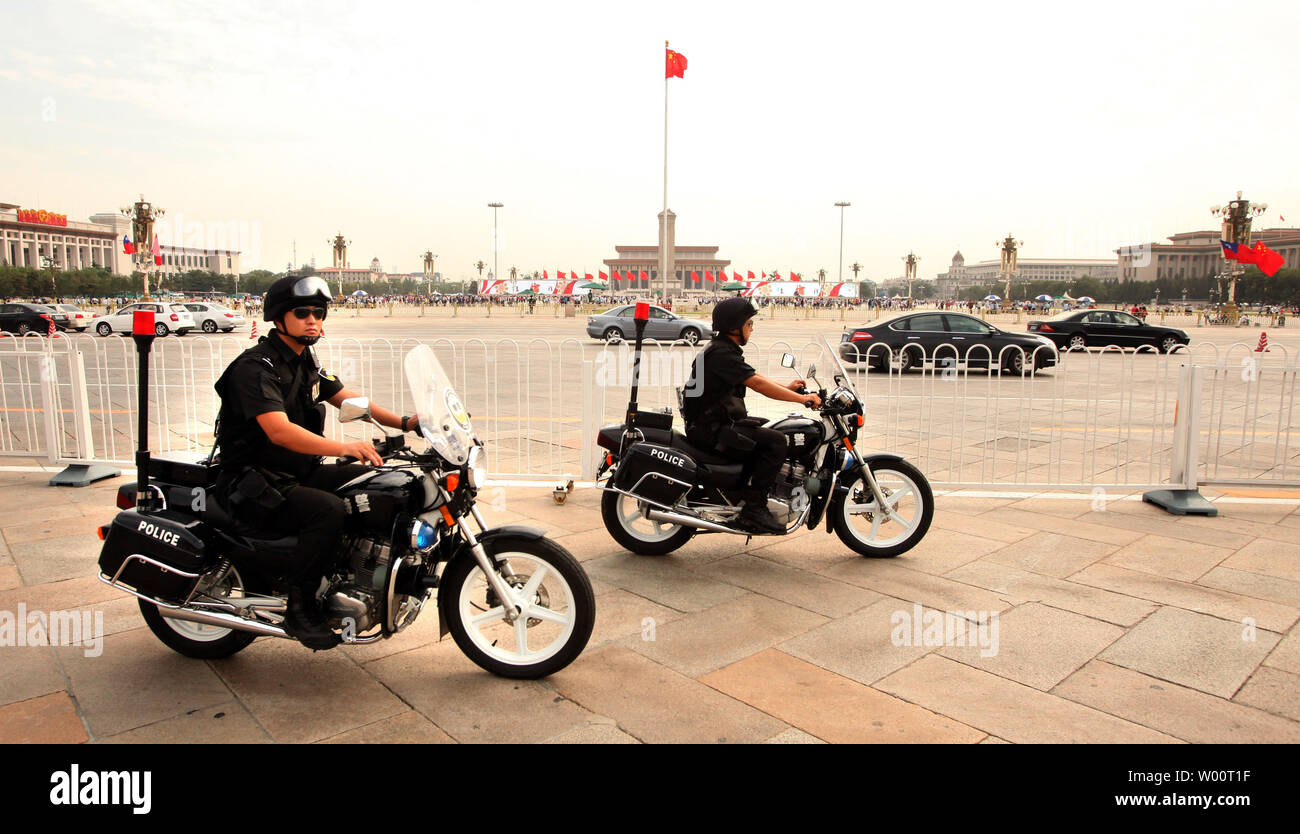 A Chinese SWAT team rides past Tiananmen Square in Beijing, September ...