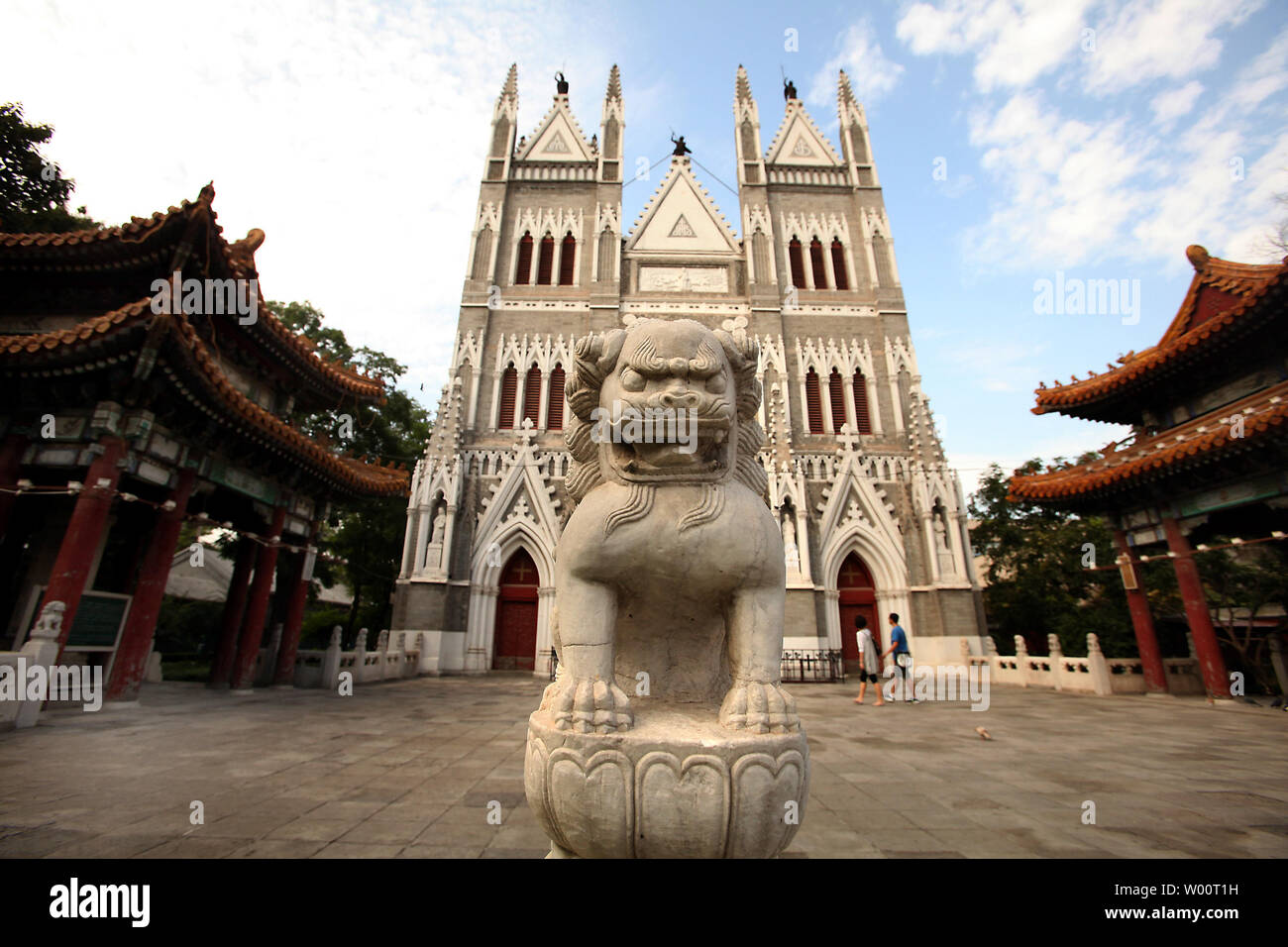 Chinese worshippers leave the Xishiku Church, originally built in 1703 ...