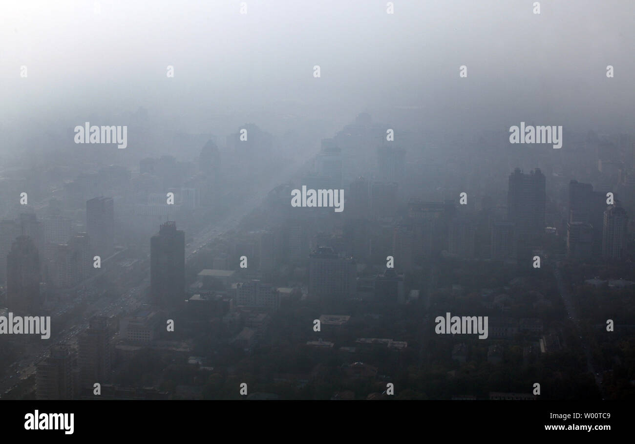 Heavy pollution hangs over central Beijing and its main road leading to ...