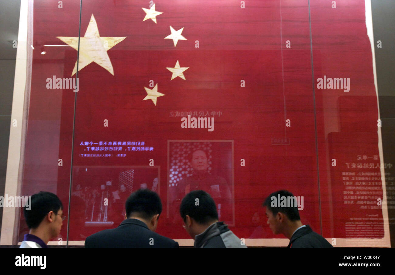 Chinese tourists look at relics from when former Chairman Mao Zedong ...