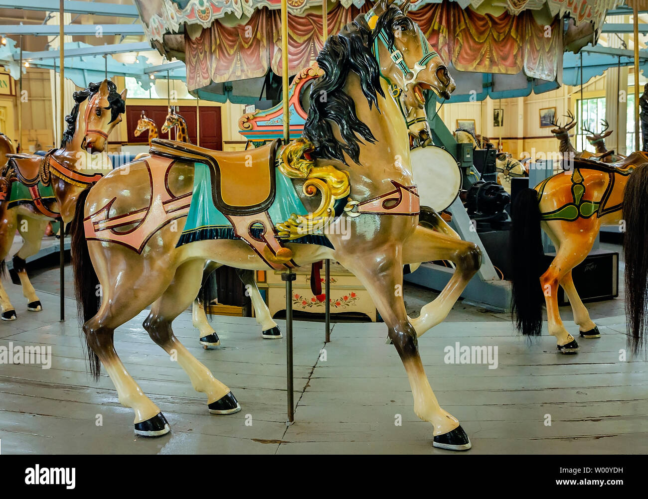 A carousel horse is part of the fanciful menagerie of zoo animals on ...