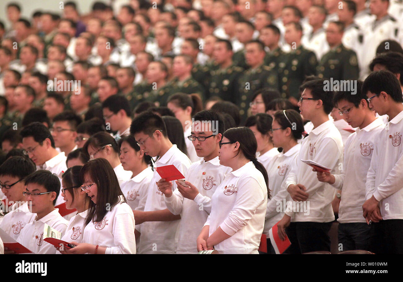 Chinese students and soldiers sing patriotic songs during the ...