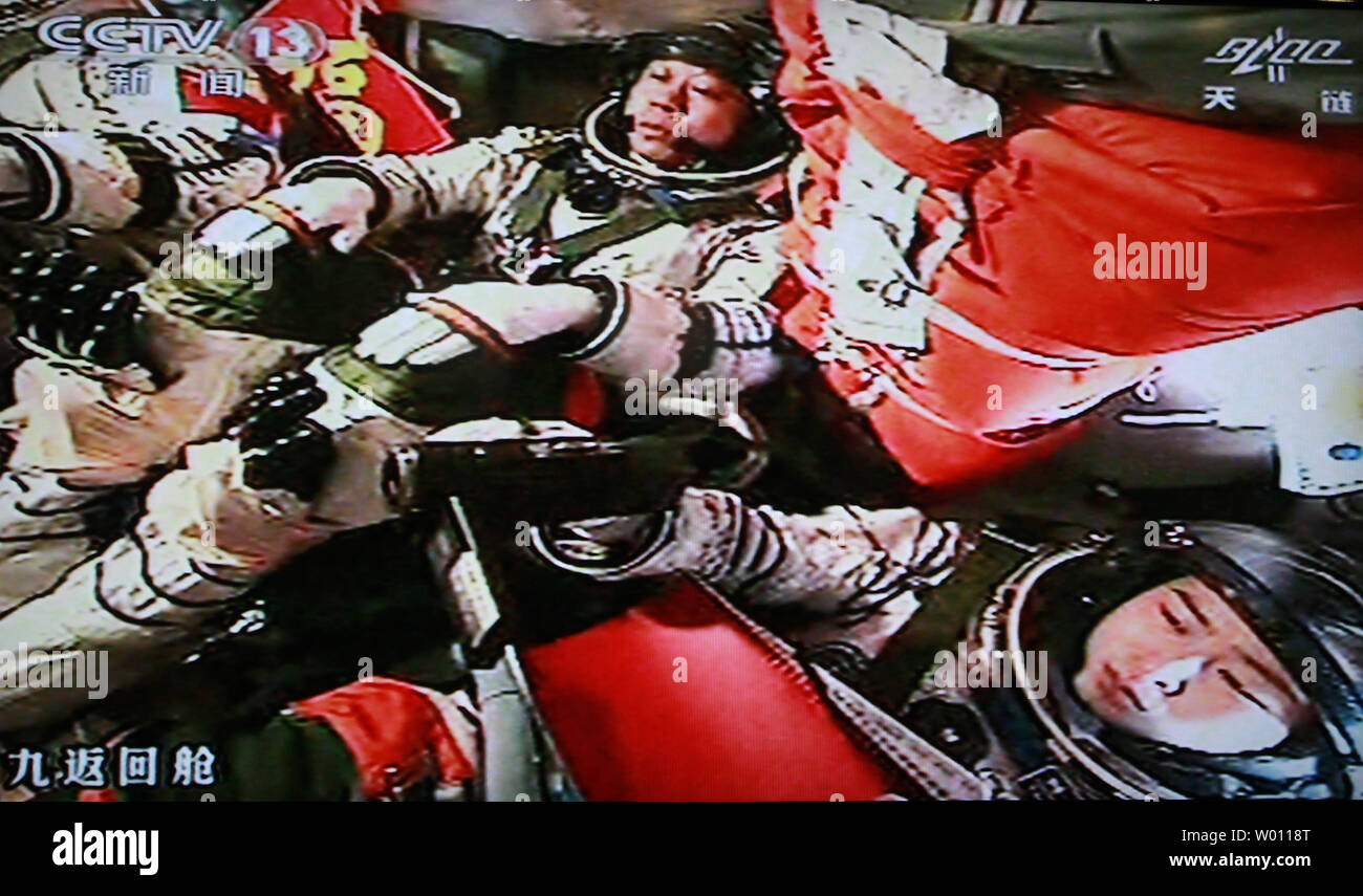 China's first female astronaut Liu Yang ( R ), along with astronauts ...