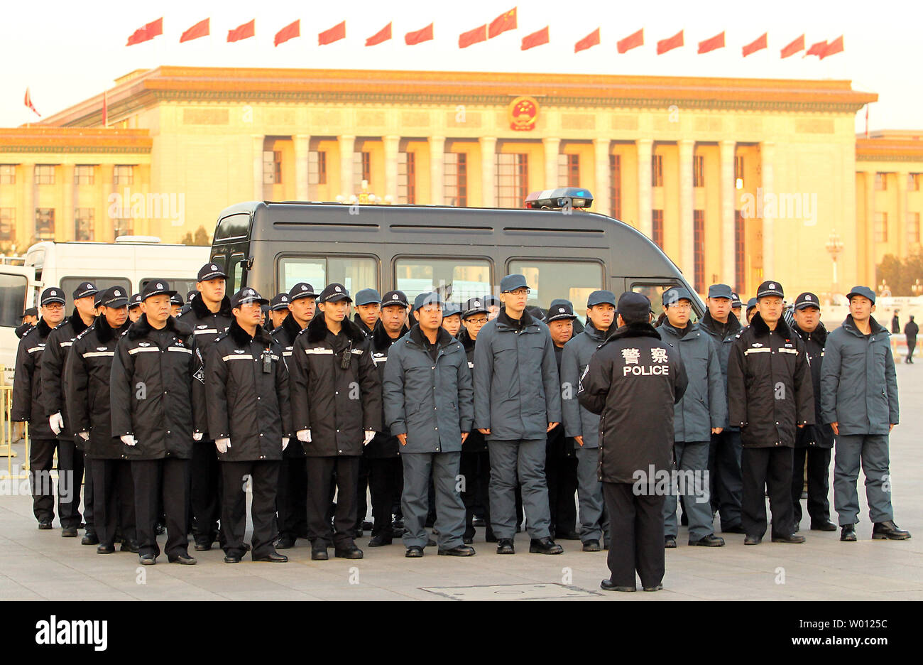 Chinese police receive instructions on patrolling the area near the ...